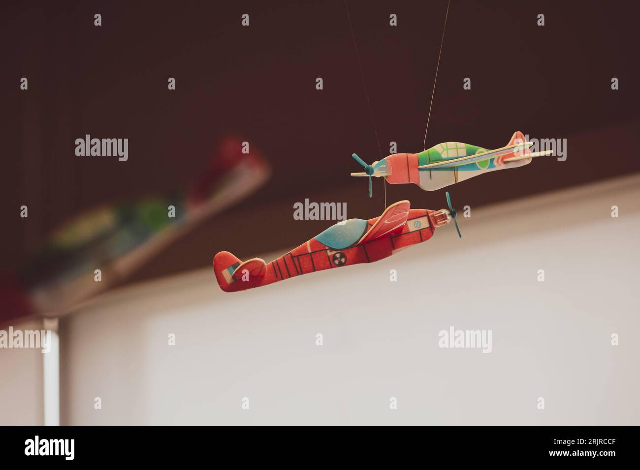 The two model airplanes suspended from the ceiling on strings Stock ...