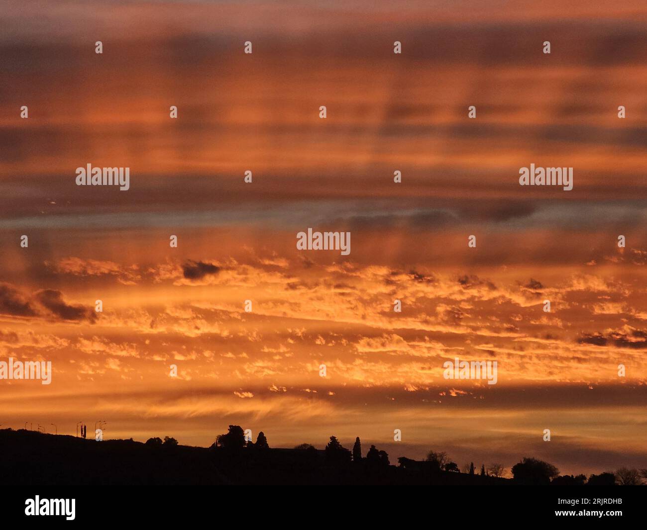 Warm sunset over grassy plain hi-res stock photography and images - Alamy