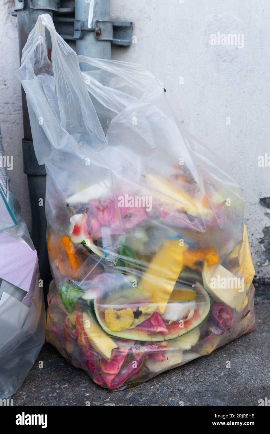 Garbage plastic bags at walkway Stock Photo - Alamy