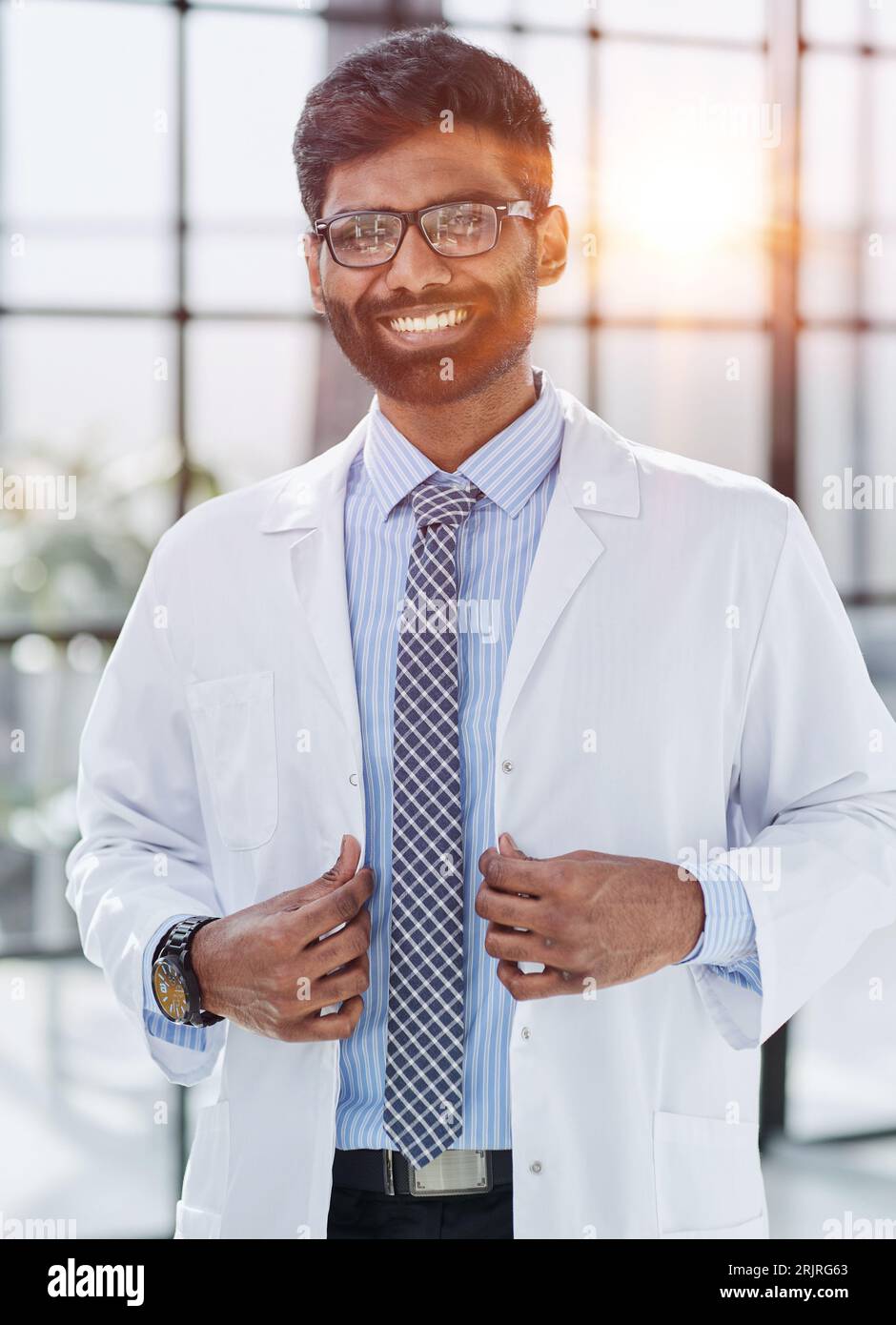 Portrait of a smiling male doctor standing in a hospital corridor Stock ...
