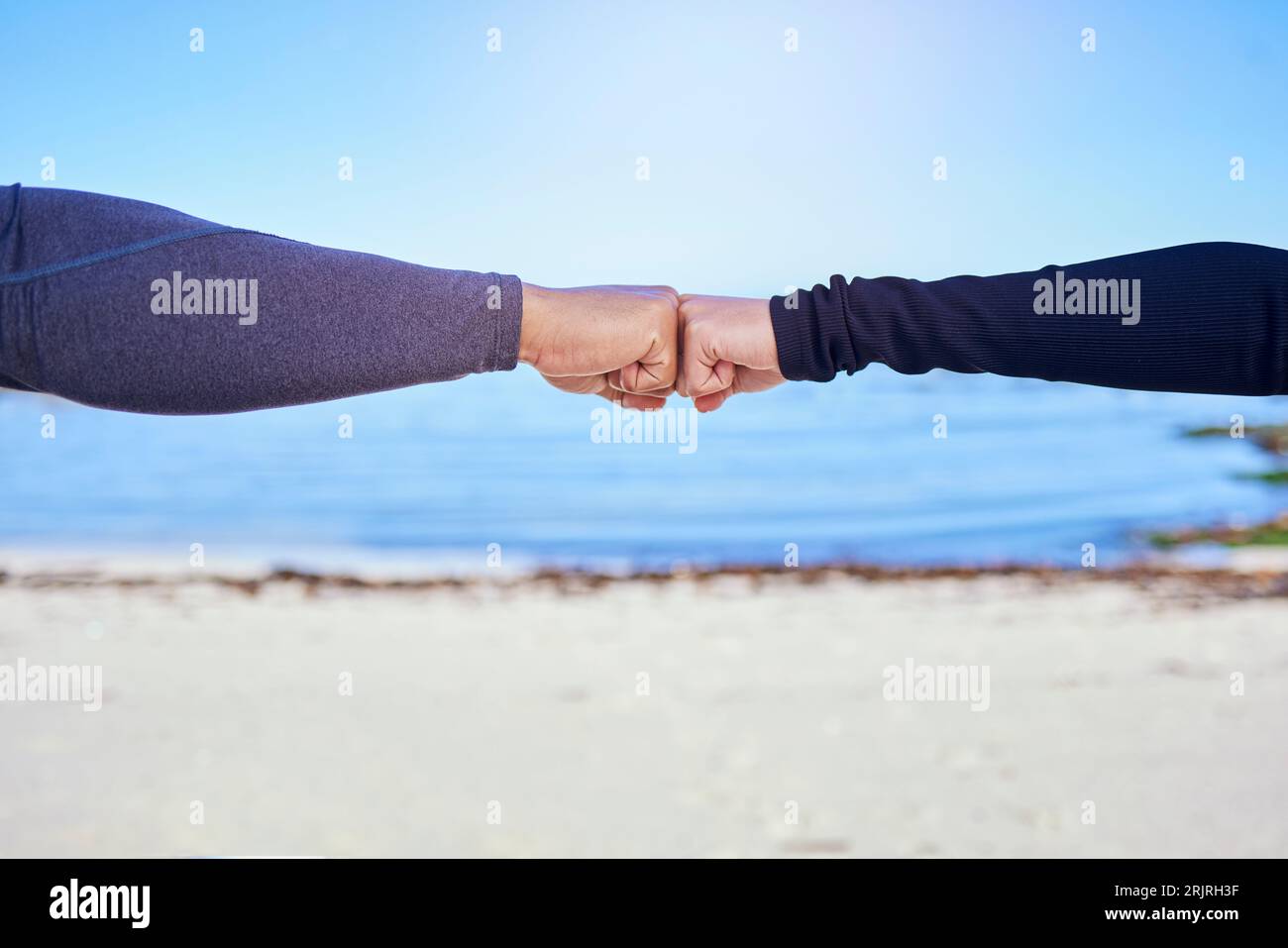 Fitness, couple and fist bump on the beach for exercise, outdoor ...