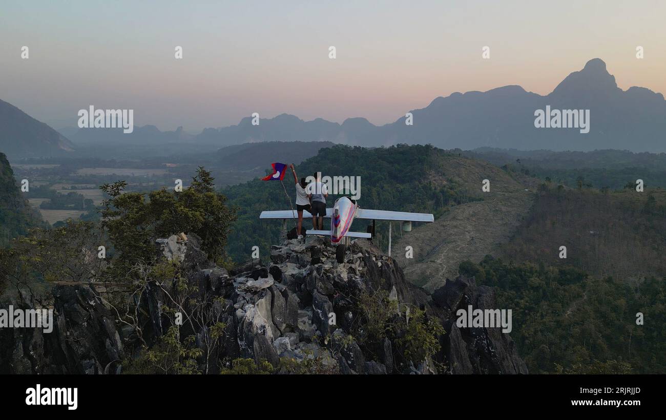 Viewpoint on top of a mountain in Vang Vieng, Laos featuring a plane ...