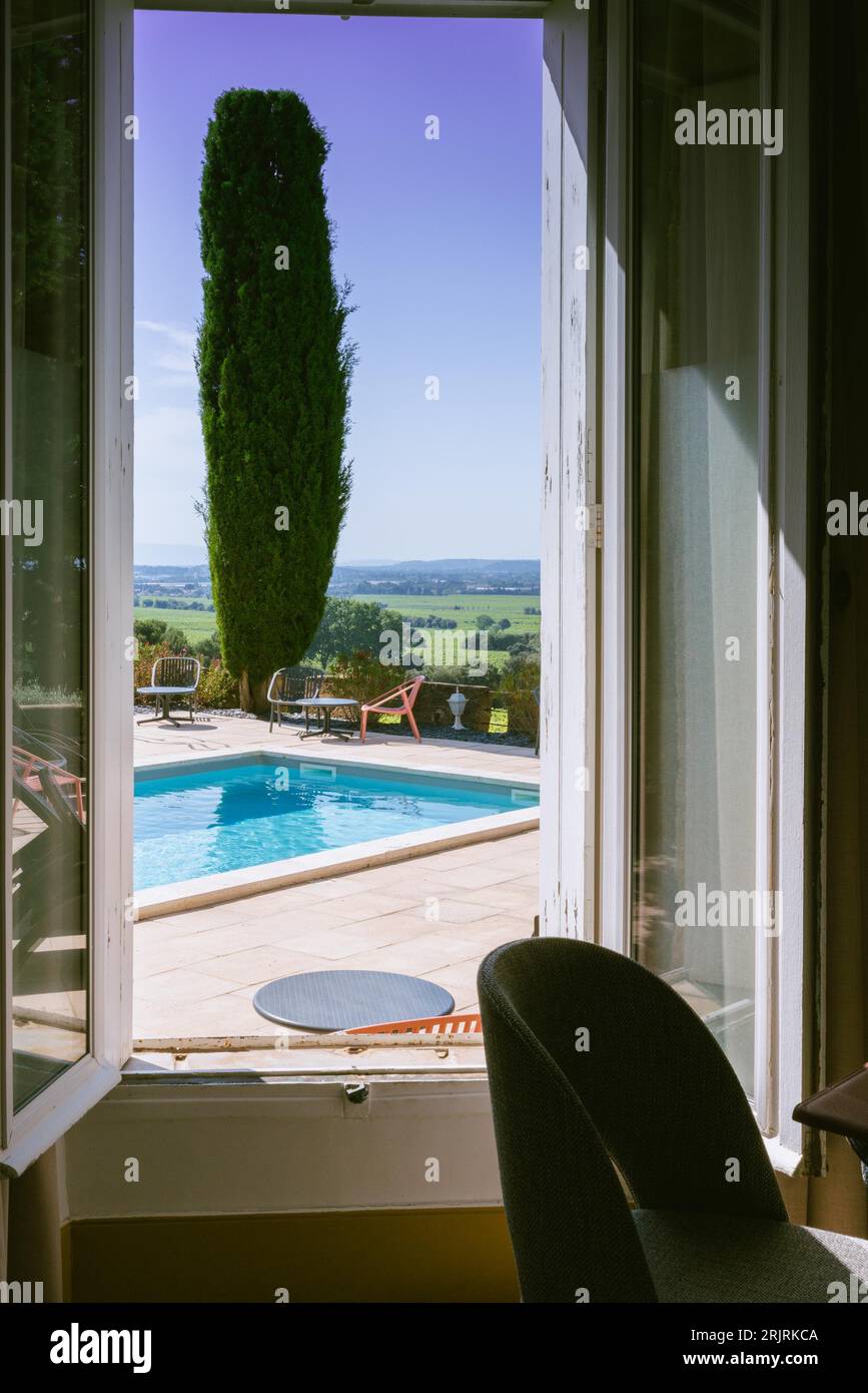 A stunning view of a lavish outdoor patio, complete with a swimming ...