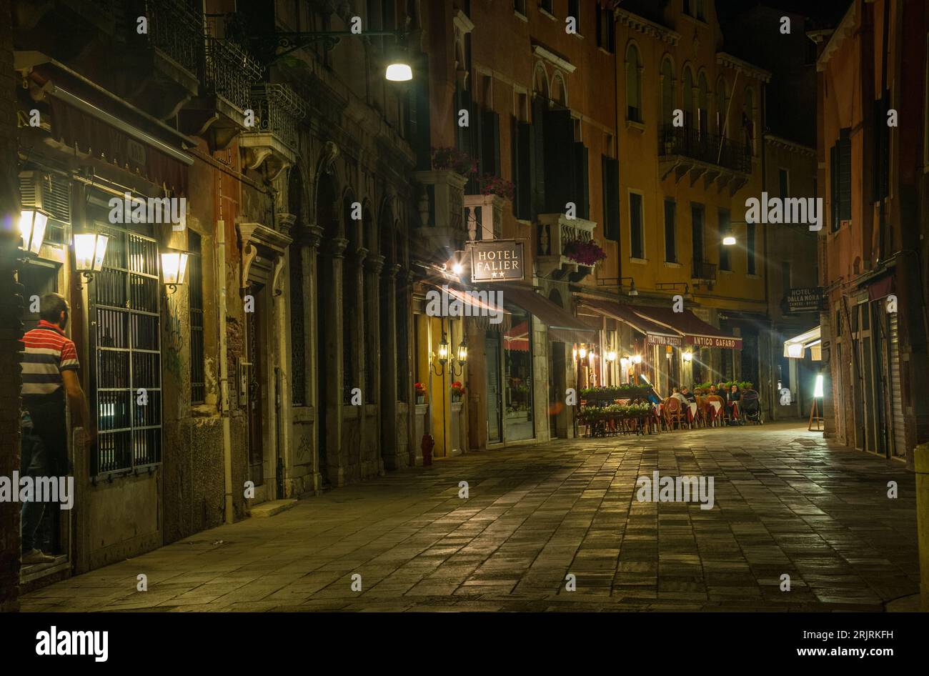 Sidewalk of storefronts in Venice, Italy Stock Photo - Alamy