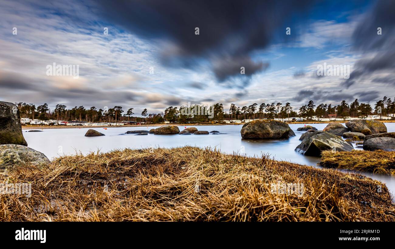A picturesque view of the coastal cliffs and clear blue waters of ...