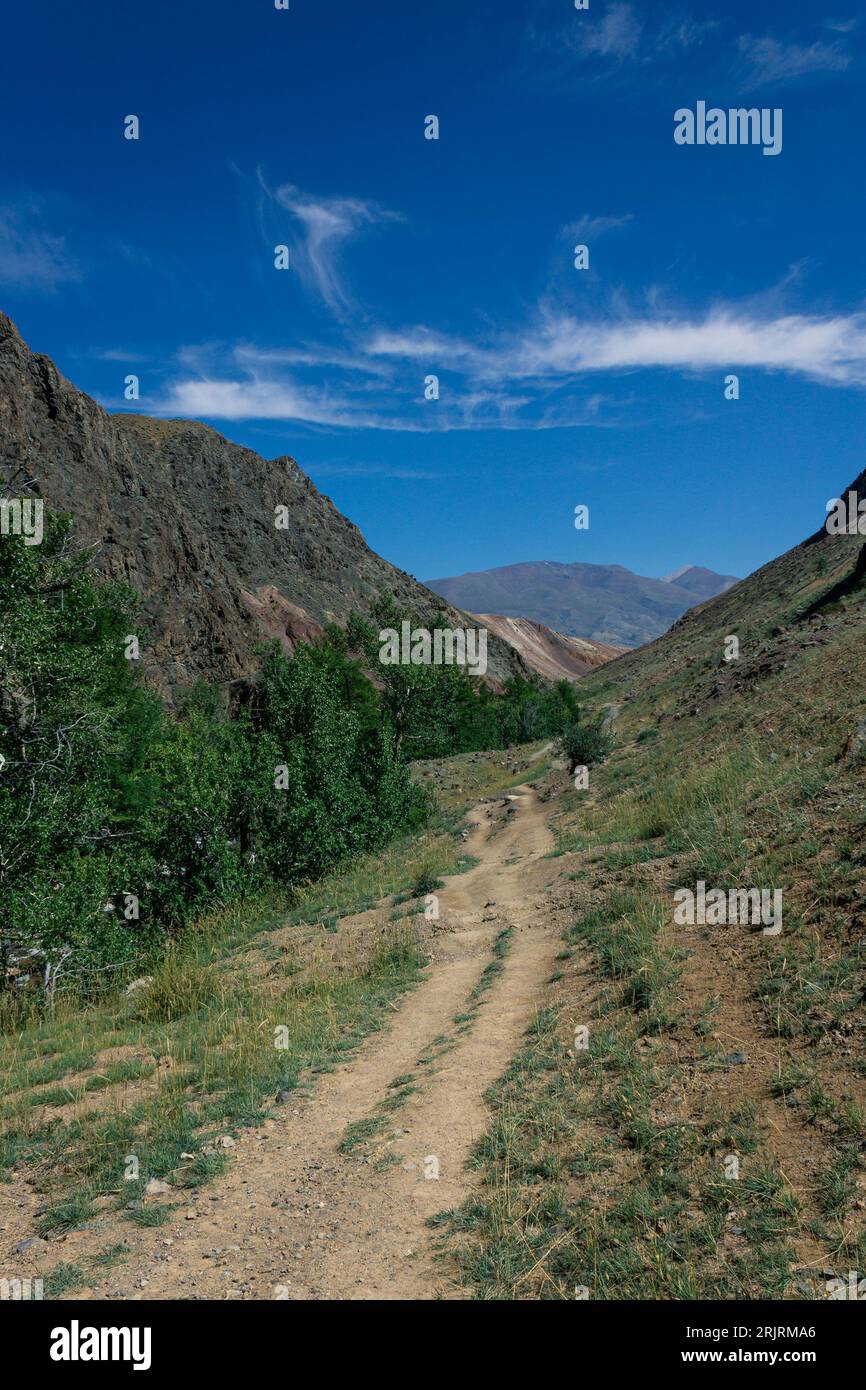 Hiking trail in the canyon between two hills. Summer tourism Stock ...