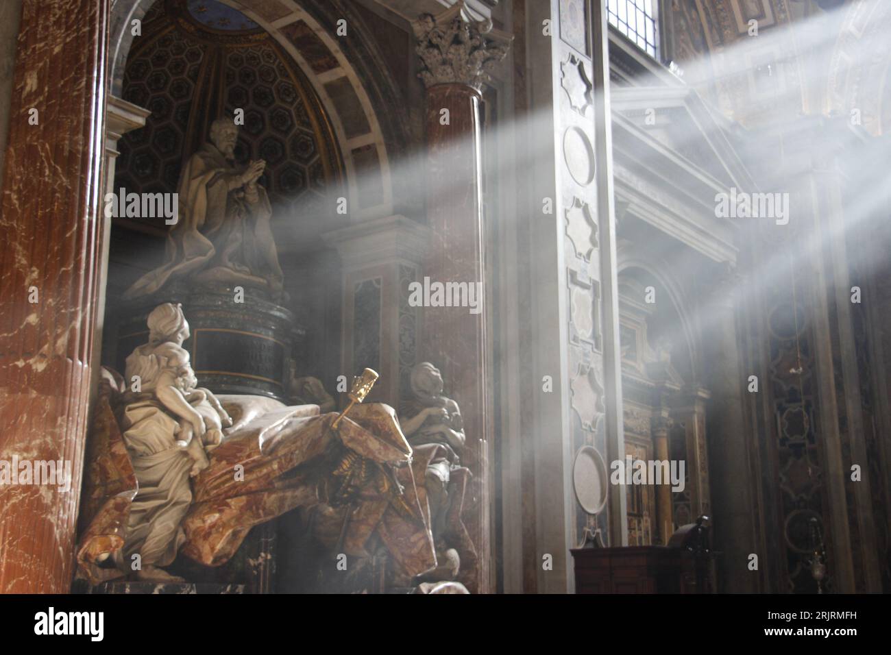 The sunlight illuminates the tomb of Alexander VII in St. Peter's ...