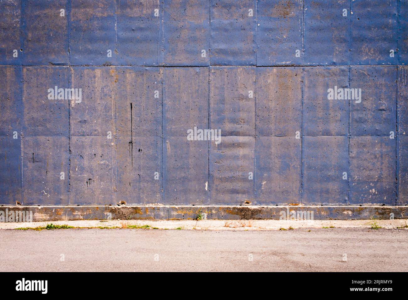 View of a textured background of cement slabs in shades of blue ...