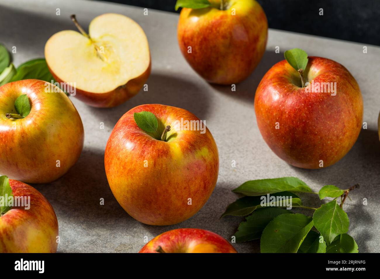 Red Organic Raw Envy Apples in a Bunch Stock Photo - Alamy