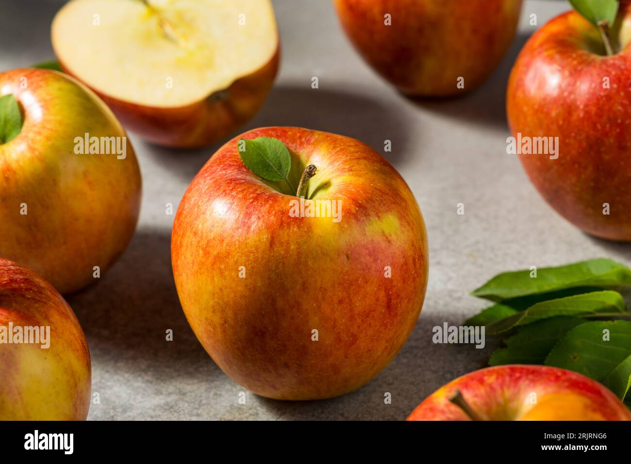 Red Organic Raw Envy Apples in a Bunch Stock Photo - Alamy