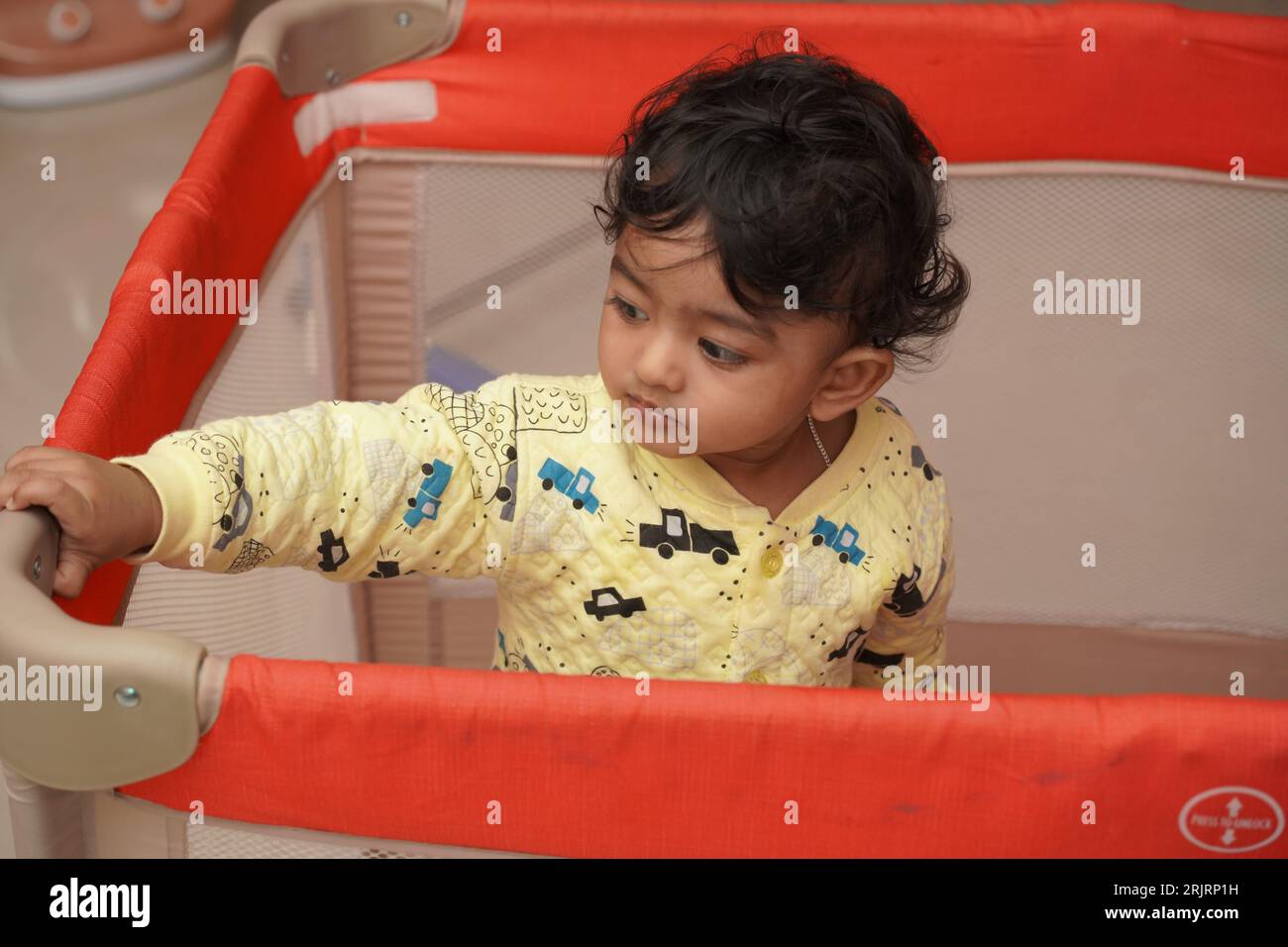 A one-year-old boy is depicted in a dejected state, conveying the ...