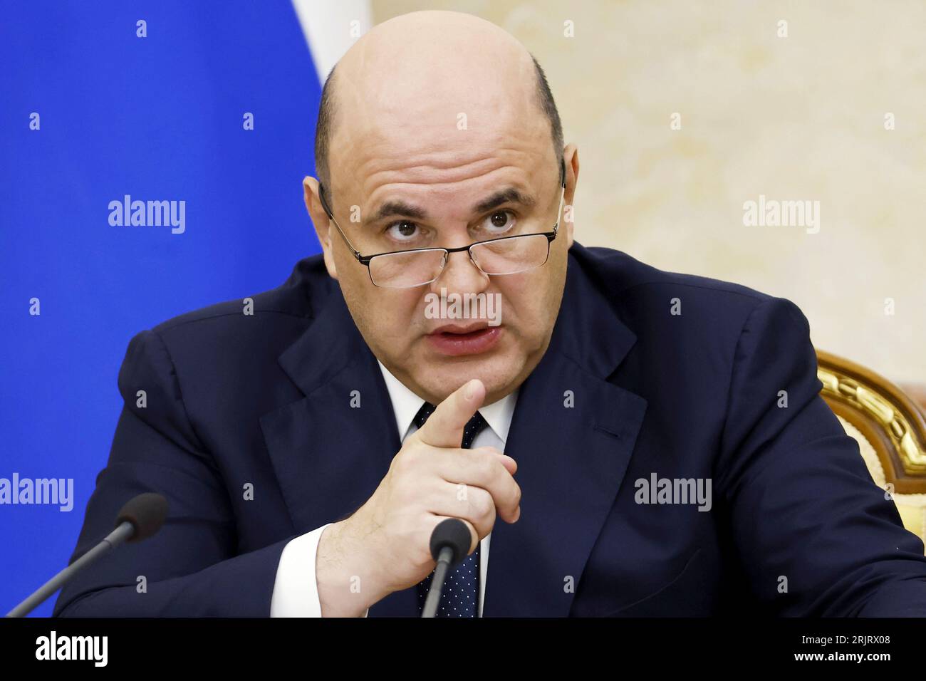 Russian Prime Minister Mikhail Mishustin gestures as he leads a cabinet ...