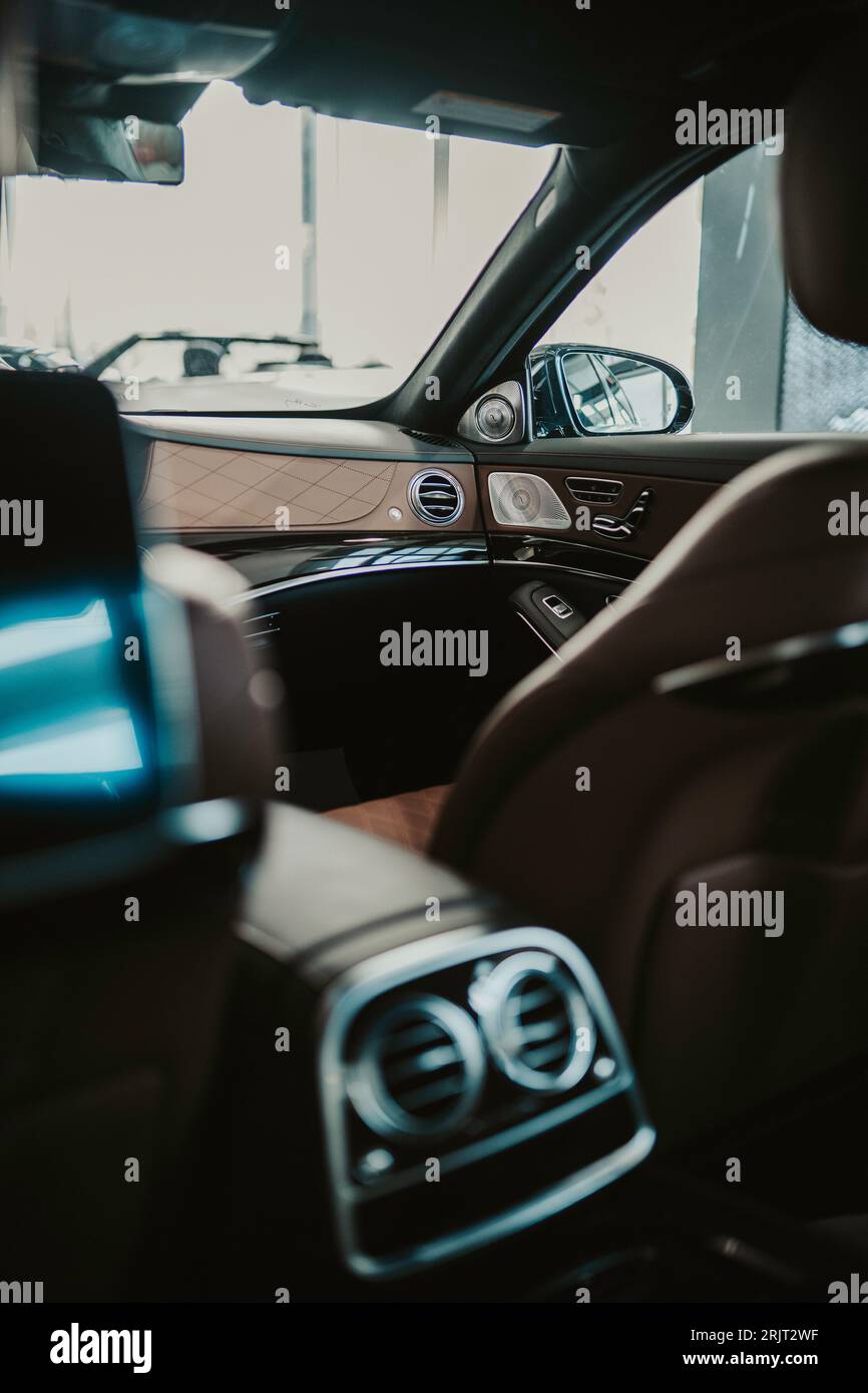 A vertical shot of details inside a luxurious Mercedes-Benz Maybach car ...