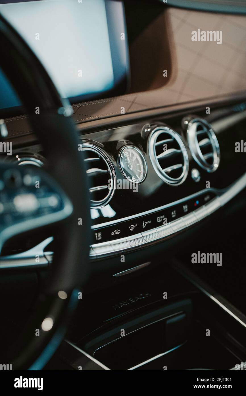 A vertical shot of details inside a luxurious Mercedes-Benz Maybach car ...