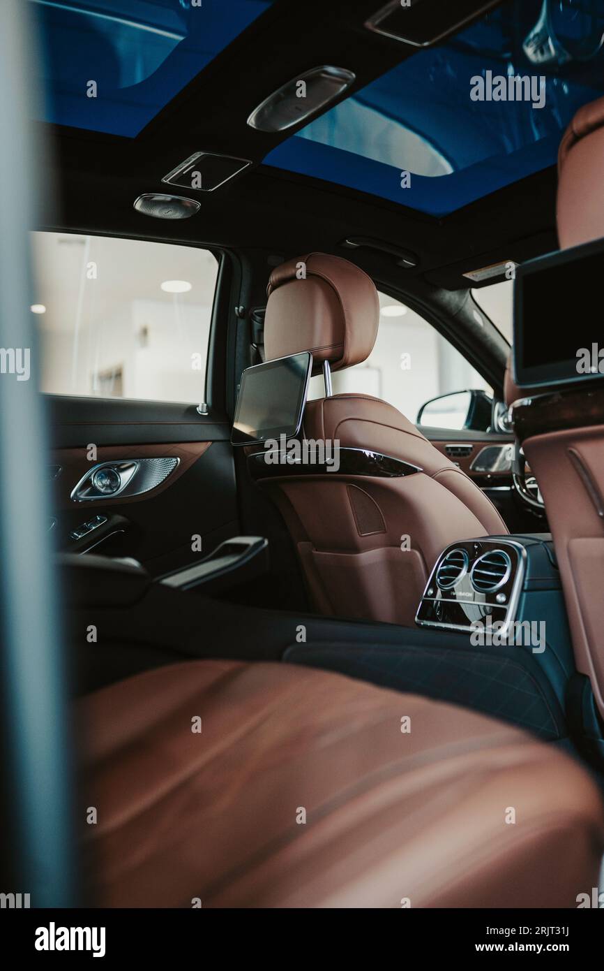 A vertical shot of details inside a luxurious Mercedes-Benz Maybach car ...