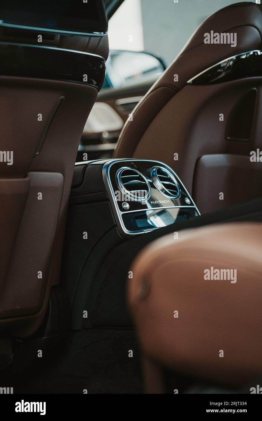 A vertical shot of details inside a luxurious Mercedes-Benz Maybach car ...