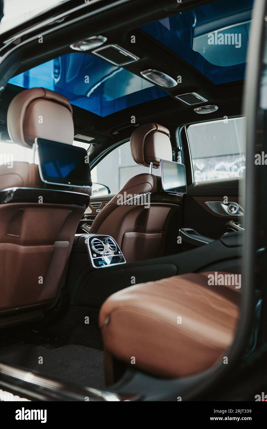 A vertical shot of details inside a luxurious Mercedes-Benz Maybach car ...