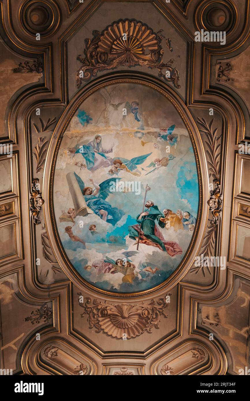 An ornate ceiling with a decorative religious oval painting in Catedral ...