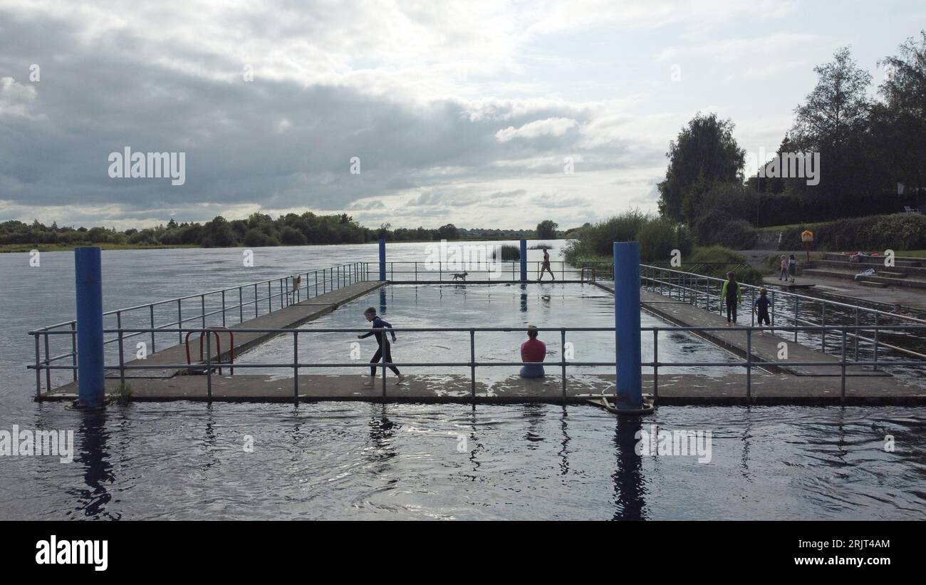 People, enjoying the warm weather, using Banagher outdoor pool in the ...