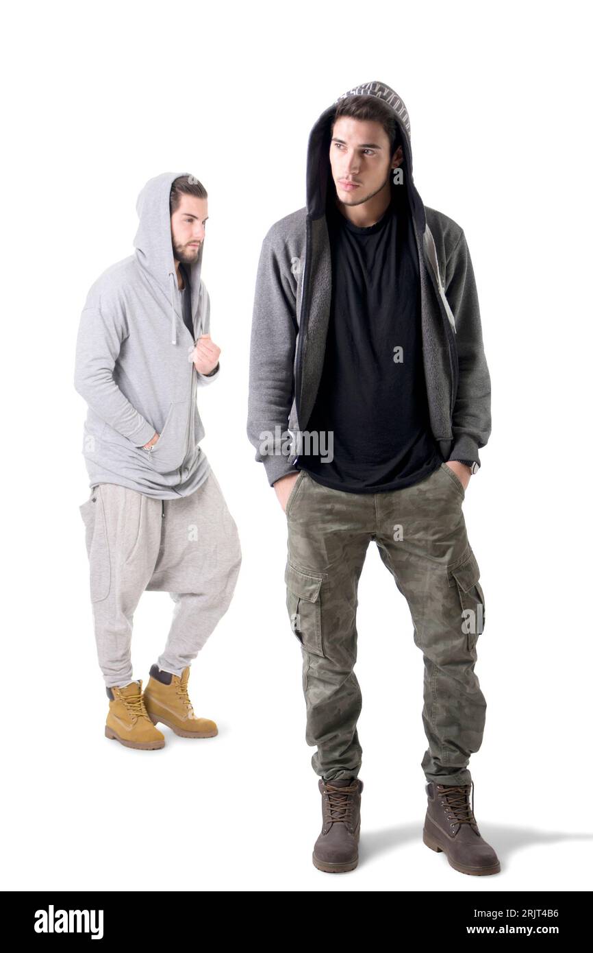 Photo of two men posing together against a blank backdrop Stock Photo ...