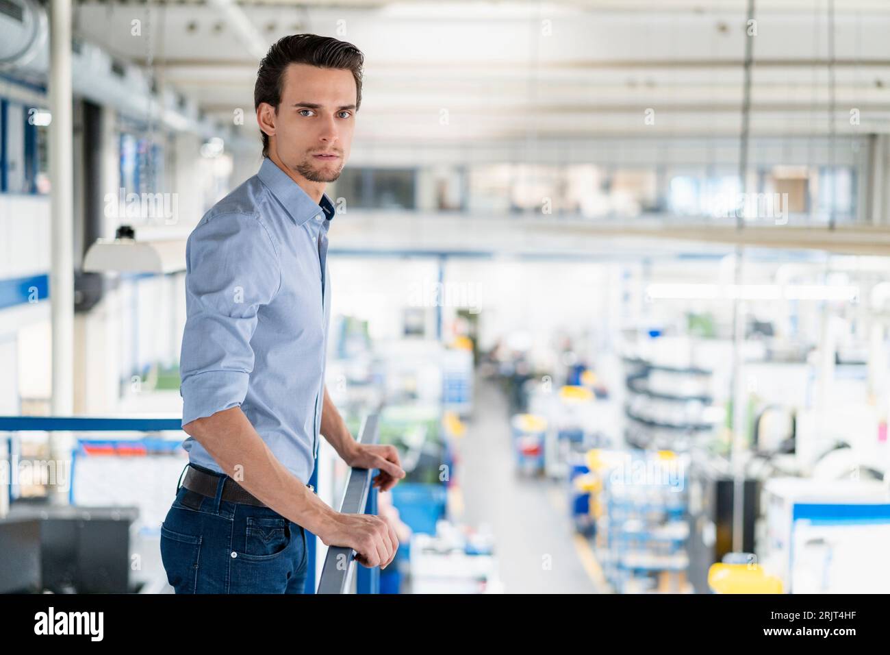 Businessman standing in shop floor hi-res stock photography and images ...