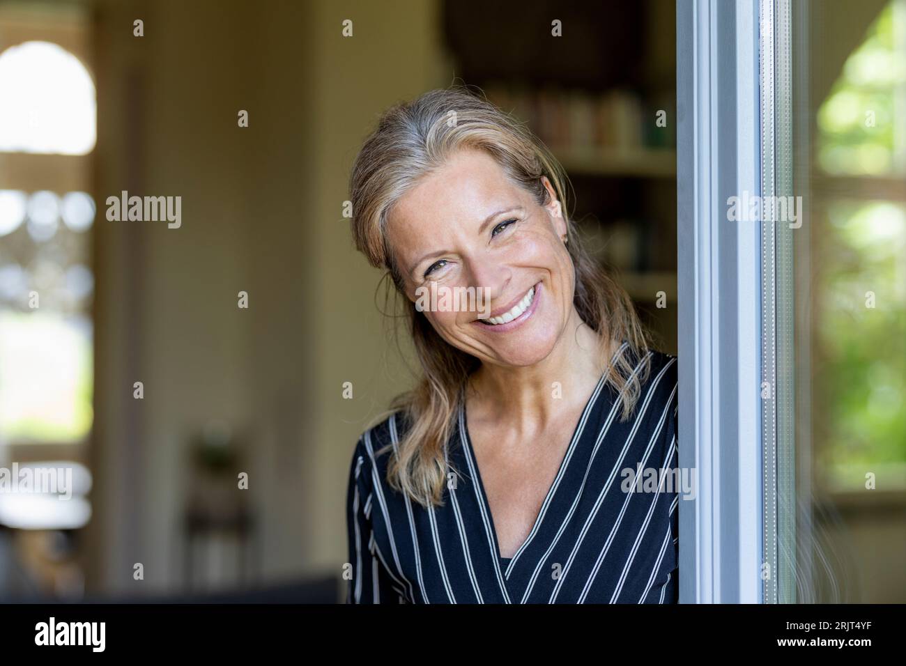 Woman mature open window hi-res stock photography and images - Alamy