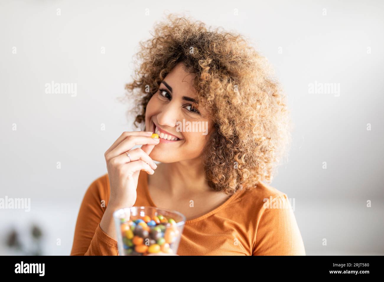 Woman holding chocolate cookie hi-res stock photography and images - Alamy