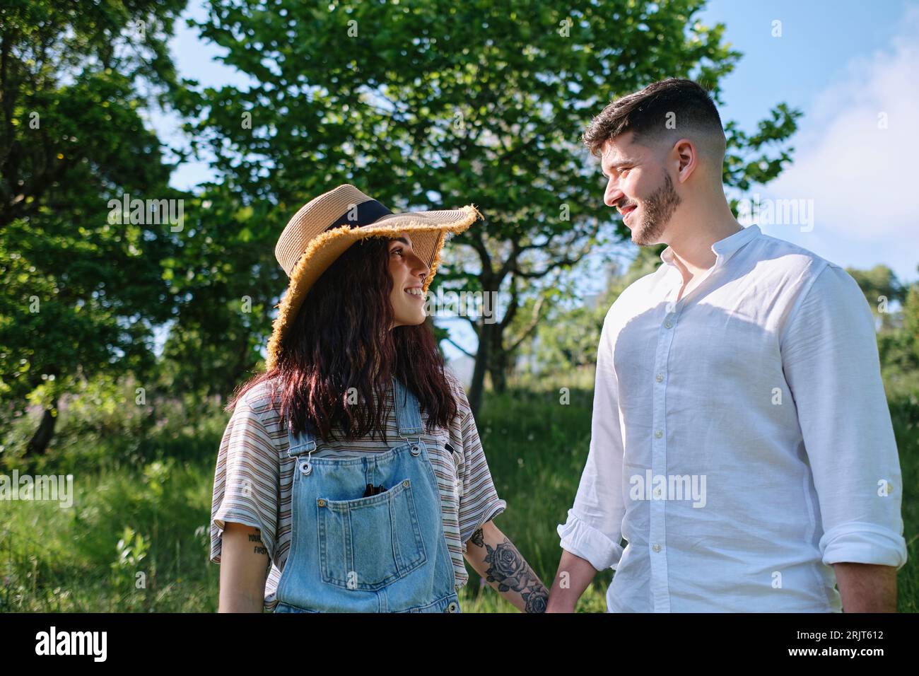 Romantic couple holding hands looking hi-res stock photography and ...