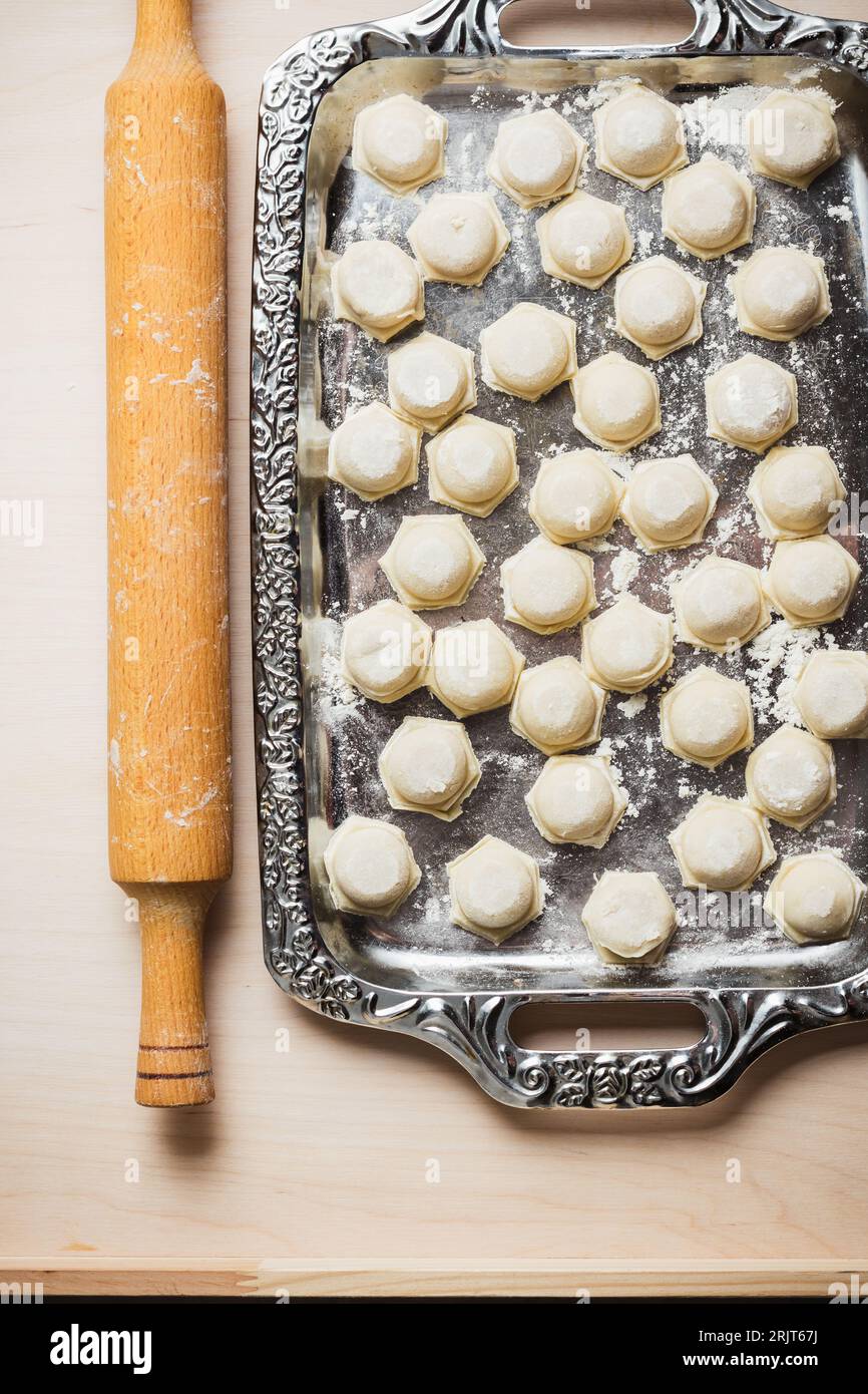 Homemade dumplings on a silver metal tray, top view Stock Photo - Alamy