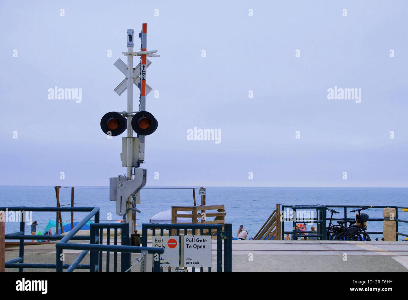 Scenic landscape featuring a railway signs with a metal fence and a ...