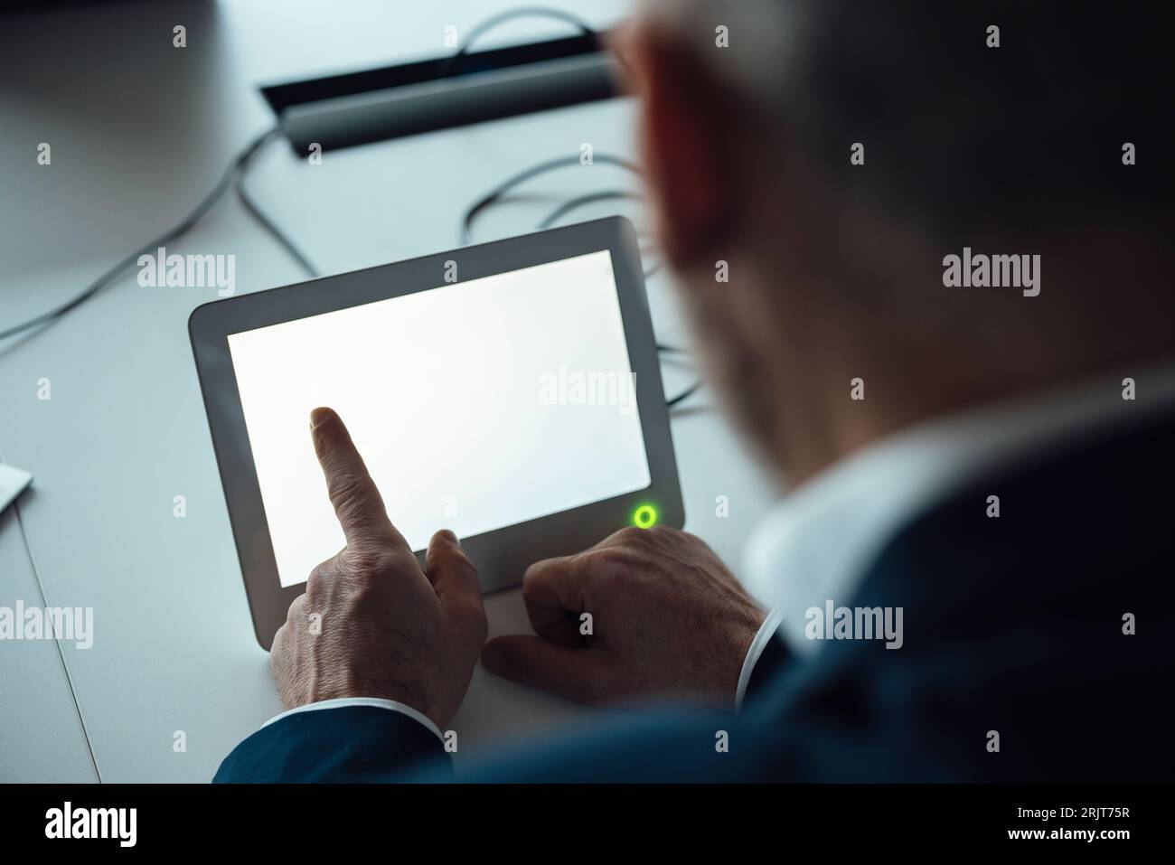 Businessman using tablet desk hi-res stock photography and images - Alamy