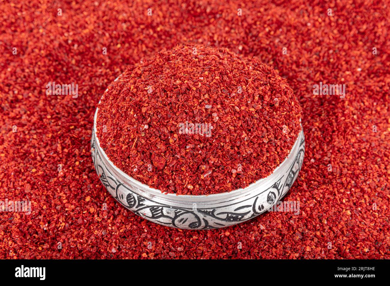 Sweet pepper drying. Ground of red pepper in wooden bowl with raw ...