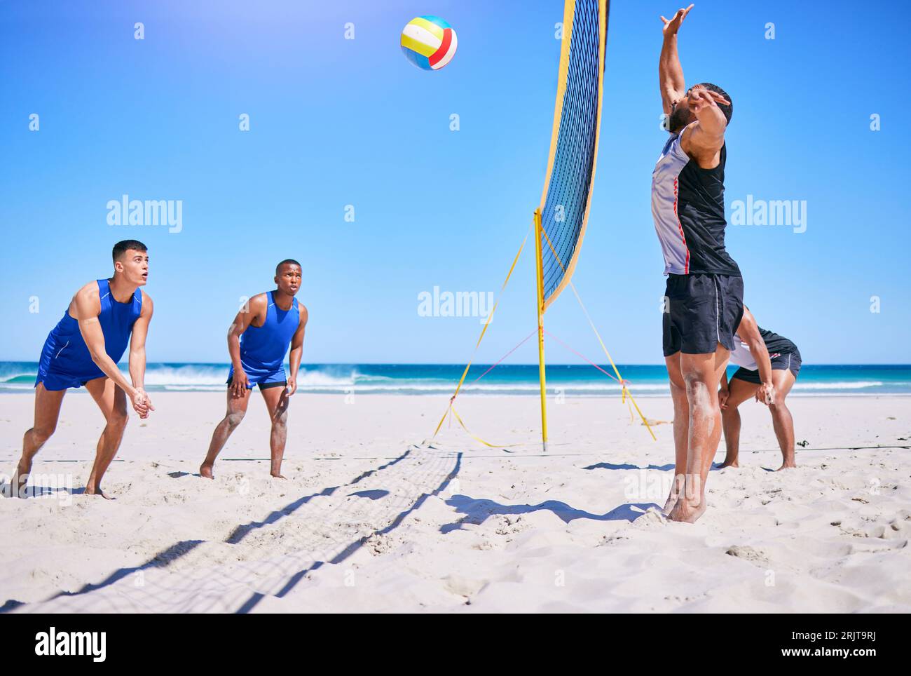Blue sky beach, volleyball and sports people playing competition ...