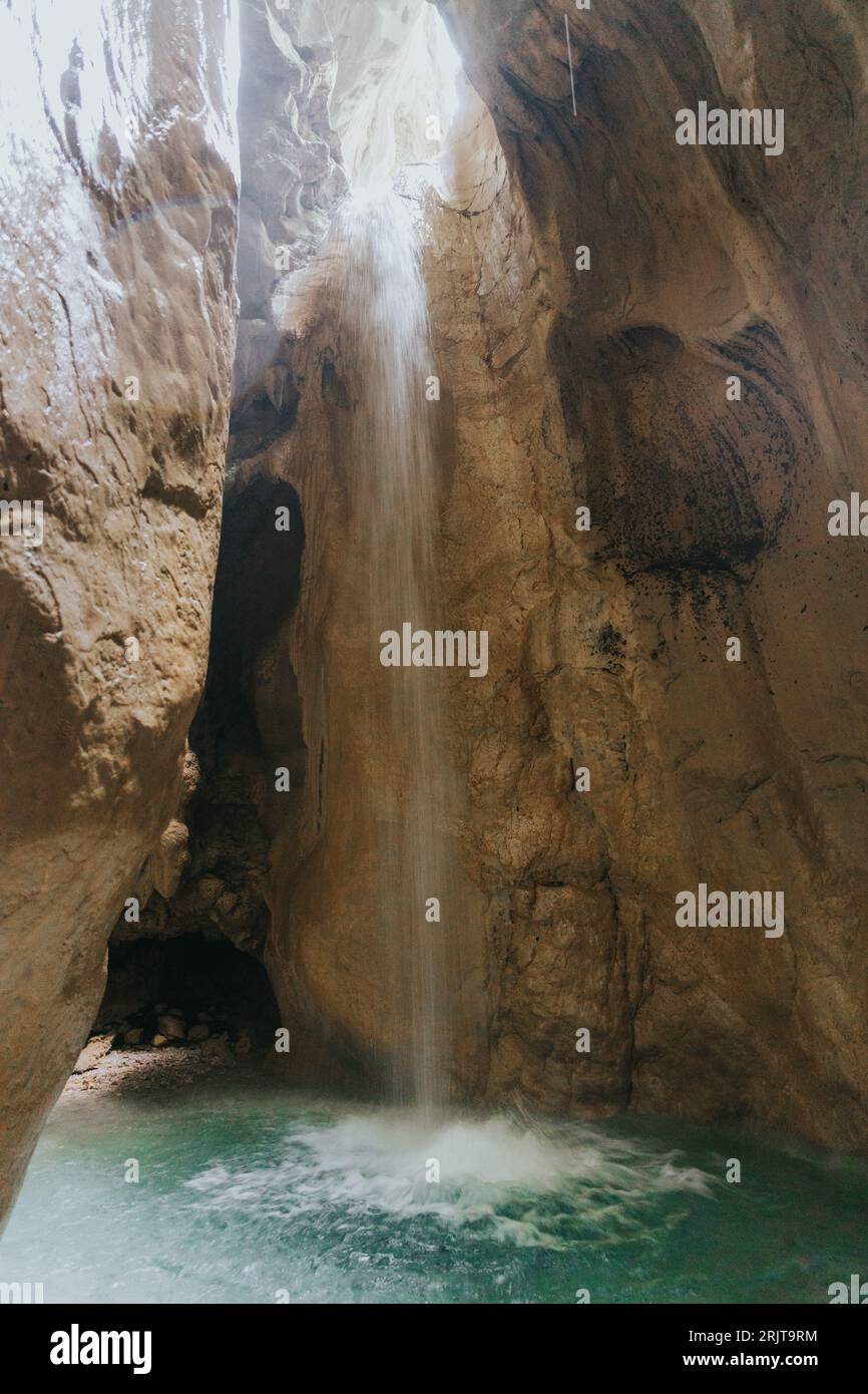 Waterfall cascading near cave lush hi-res stock photography and images ...