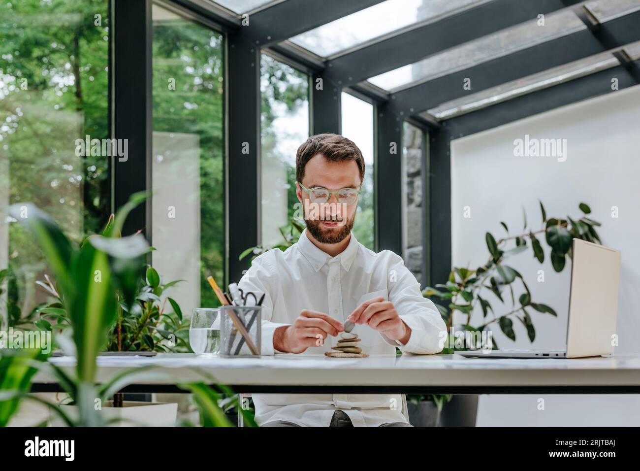 Man stacking stones hi-res stock photography and images - Alamy