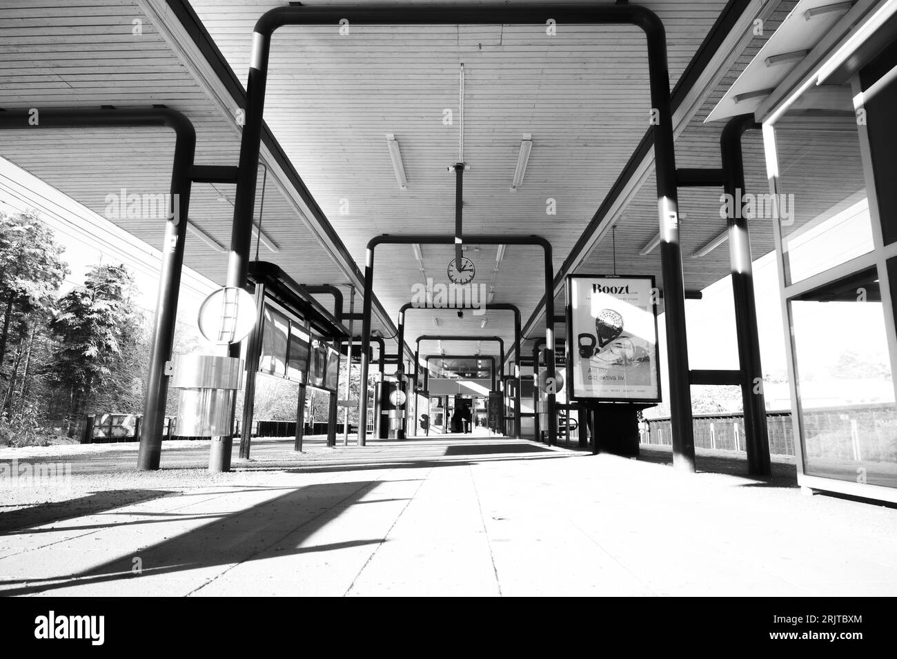 A train is standing at the platform with open doors, ready to welcome ...