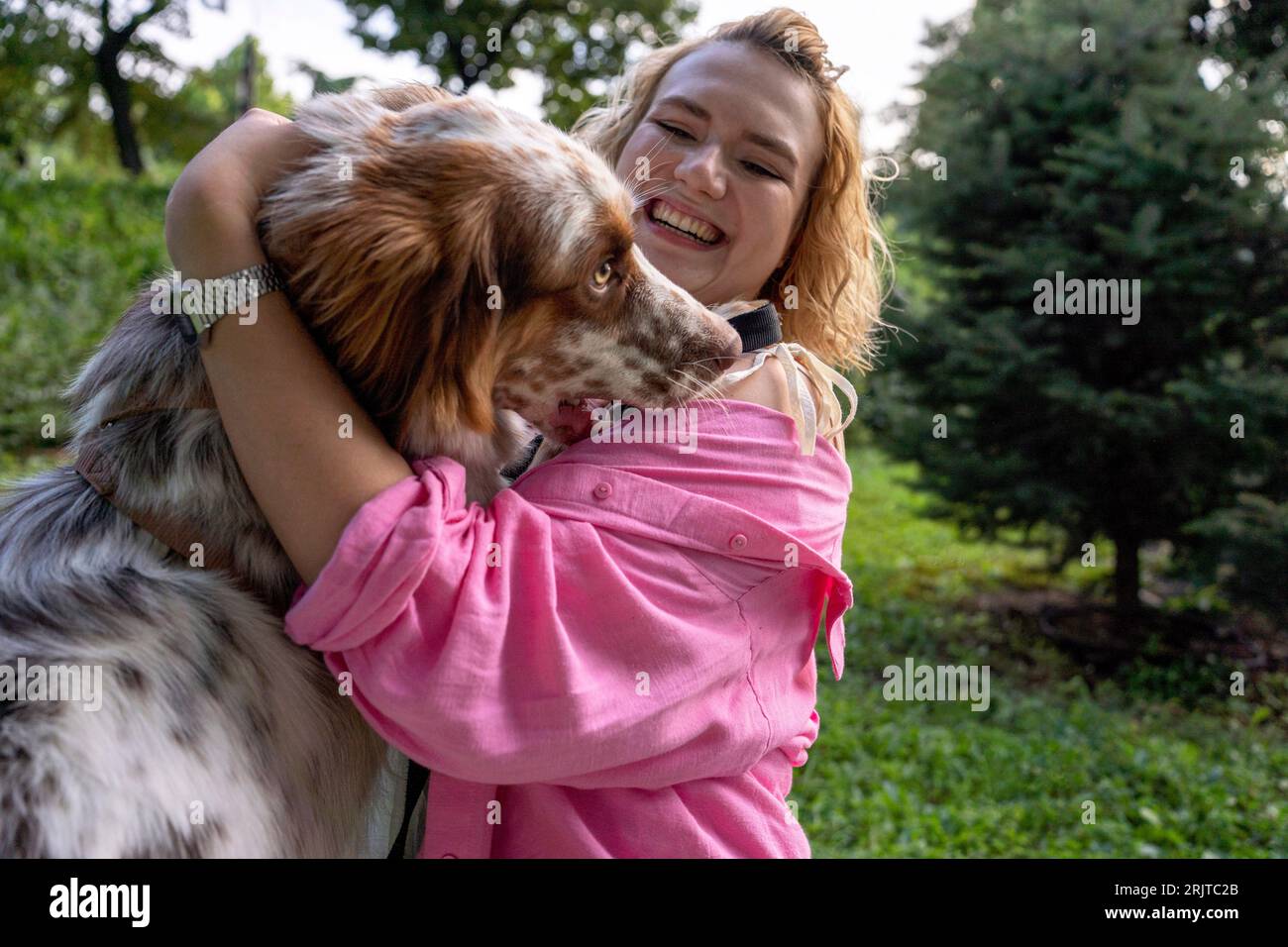 Woman hugging dog hi-res stock photography and images - Alamy