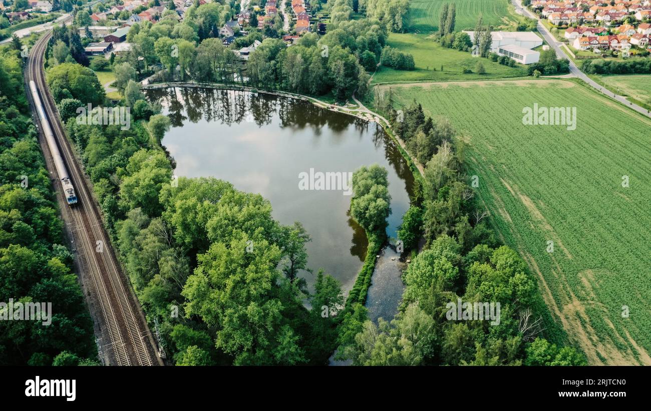 Aerial view of a railway line meandering through a densely populated ...
