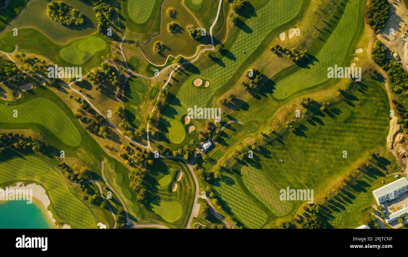 Aerial view of a golf course with green grass and sand traps, perfect ...