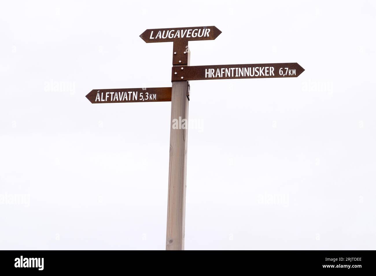 A close-up of multiple road signs indicating directions to several ...
