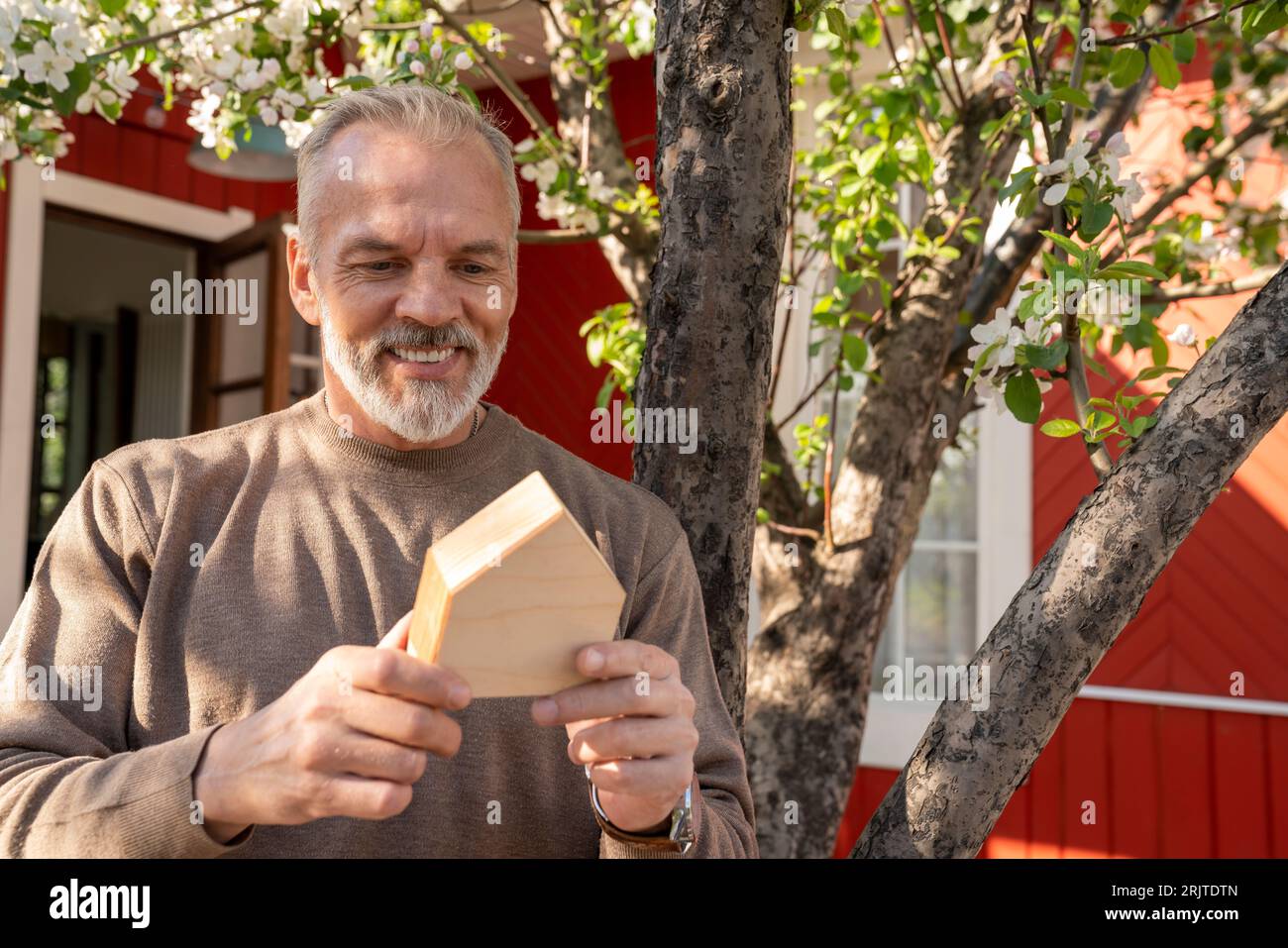Man standing near tree hi-res stock photography and images - Alamy