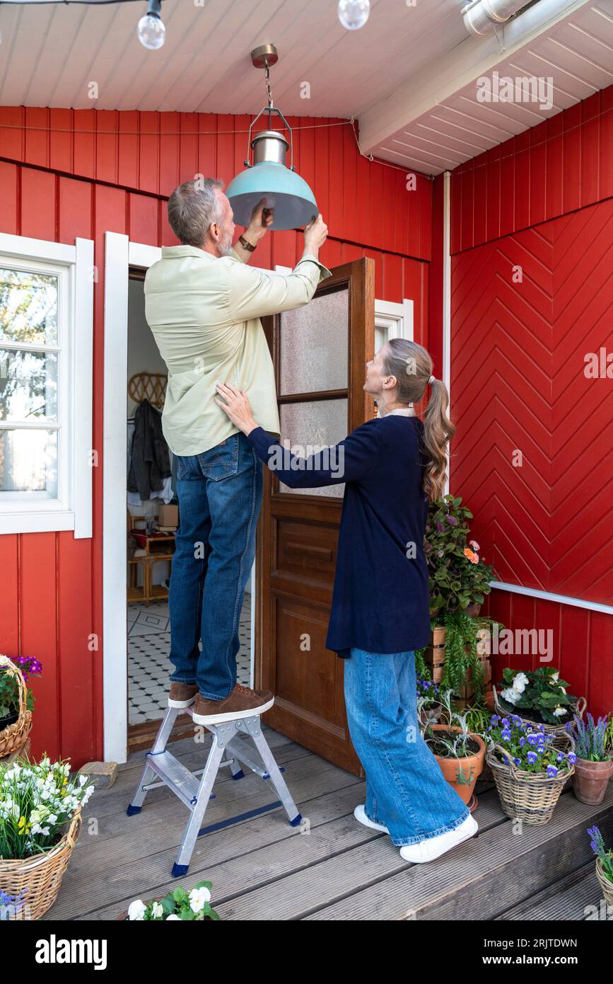 Woman mounting hi-res stock photography and images - Alamy