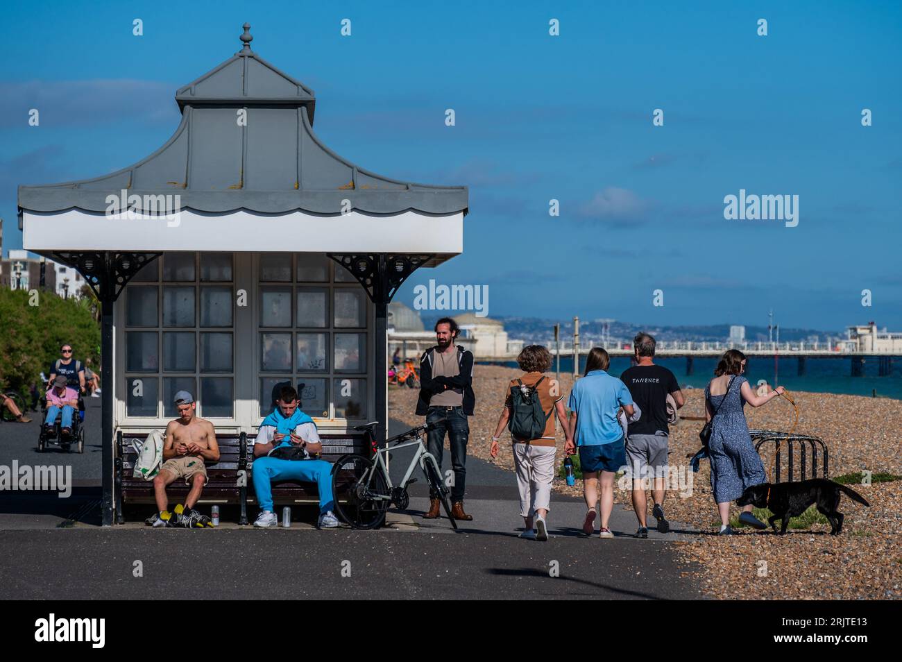 People enjoy the beach and promenade. Life by the seaside in Worthing ...
