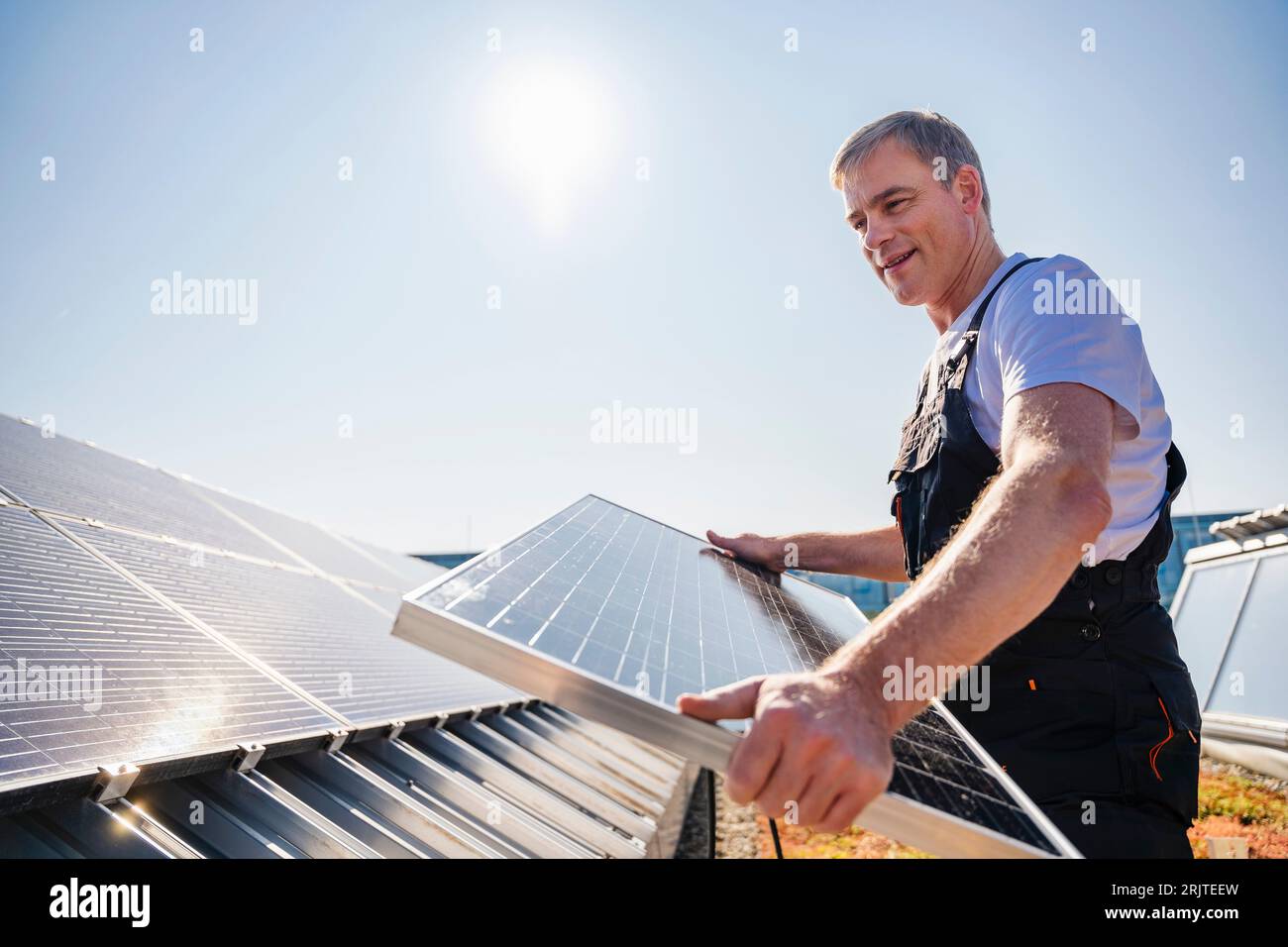 Installing solar panels hi-res stock photography and images - Alamy