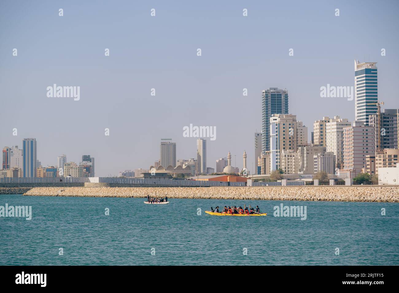 An aerial view of tranquil blue water and skyscrapers on a sunny day in ...