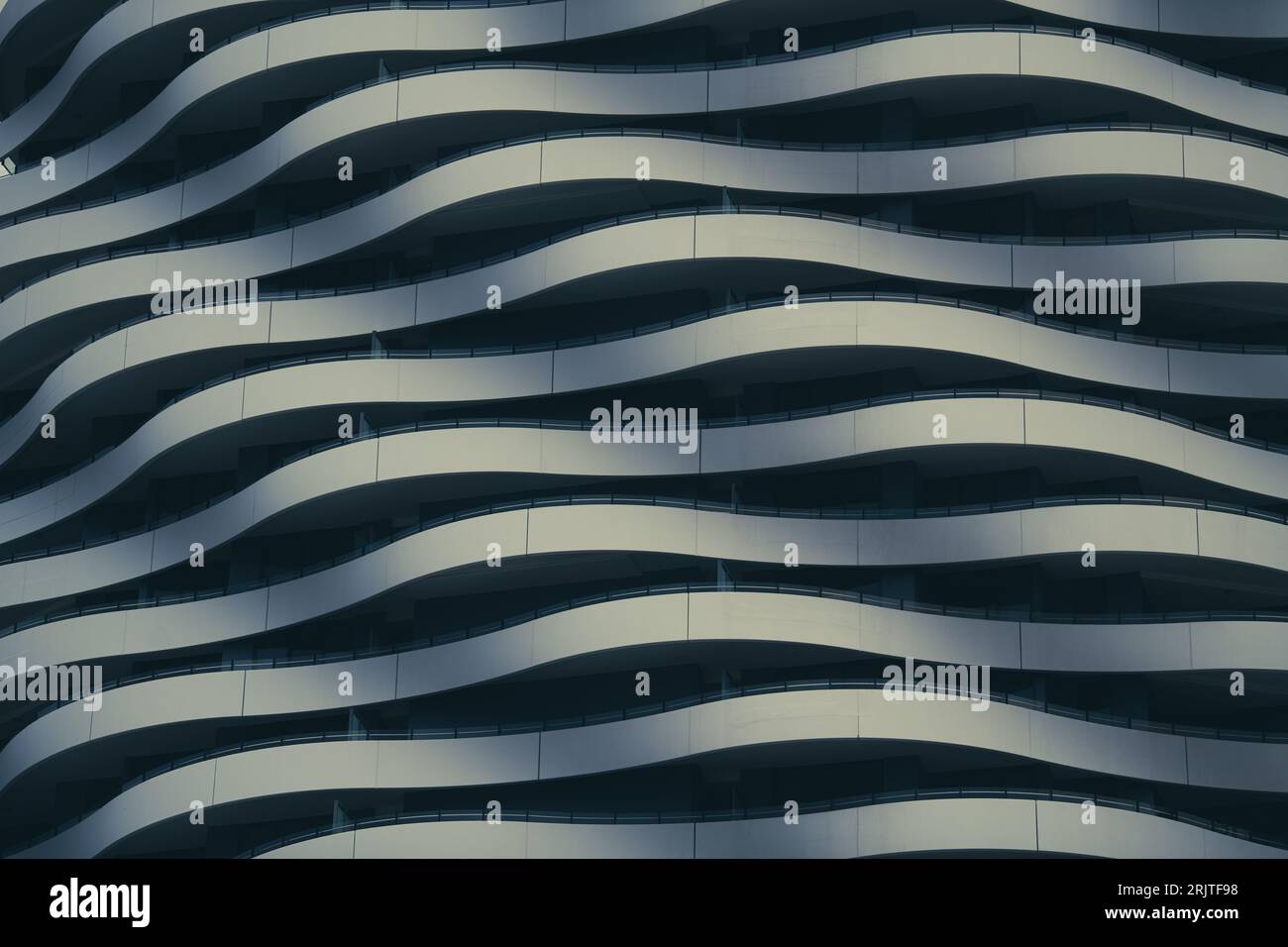 An exterior view of an apartment building featuring a unique undulating ...