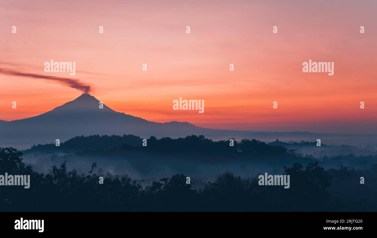 A stunning landscape view of a volcano illuminated with a majestic ...