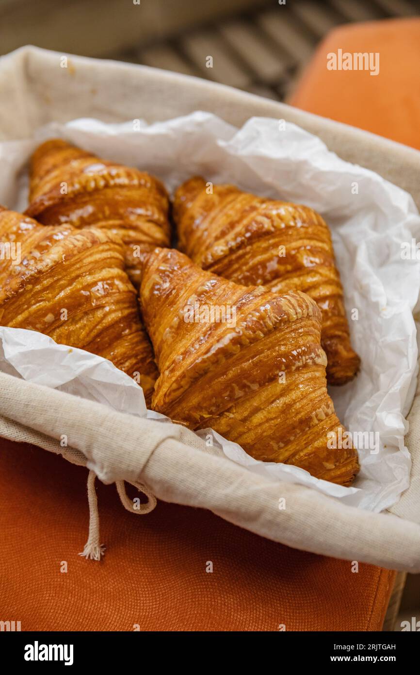 Crispy croissants in a wicker basket Stock Photo - Alamy