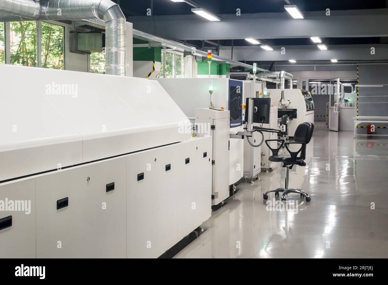 production line for printed circuit board, automatic chip mounter Stock ...