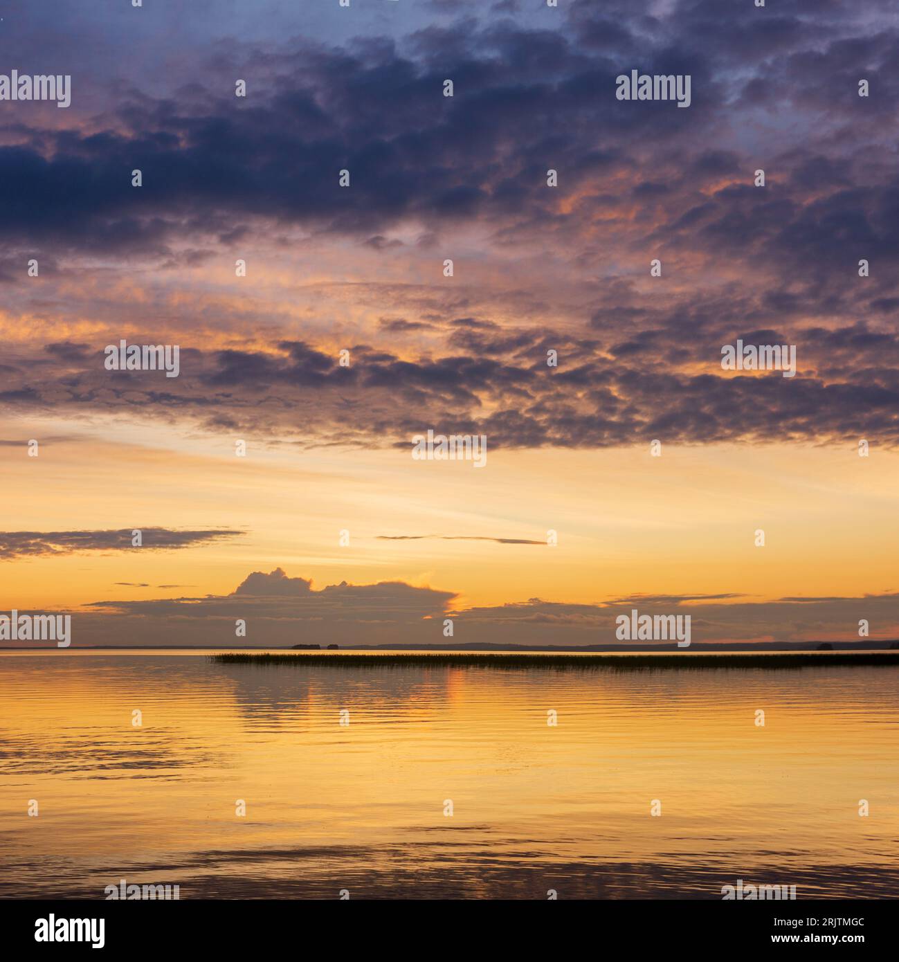 natural landscape with a beautiful sunset over the wide northern lake ...